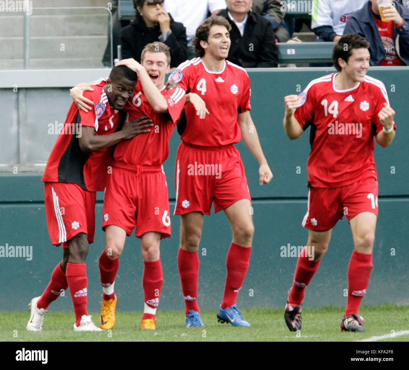 Canada's Tosaint Ricketts, left, celebrates with his teammates, Nikloas ...