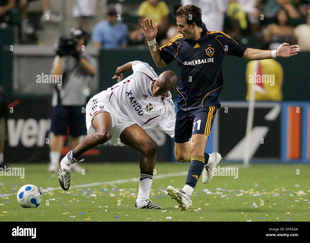 Real Salt Lake's Eddie Pope, left, flicks the ball away from Los ...