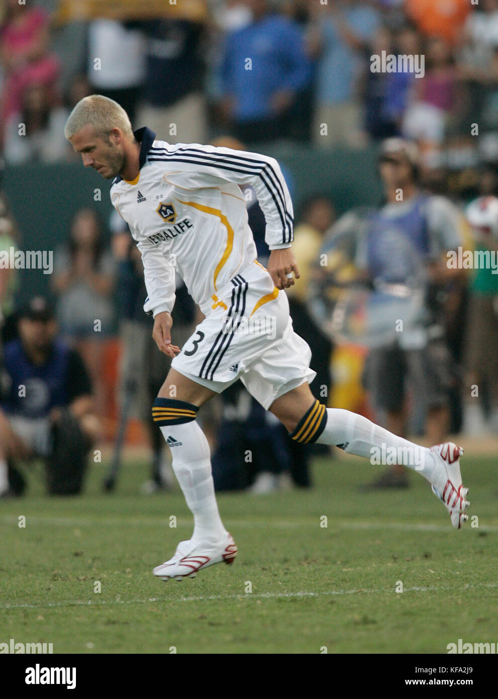 Los Angeles Galaxy's David Beckham runs on to the field against Chelsea ...