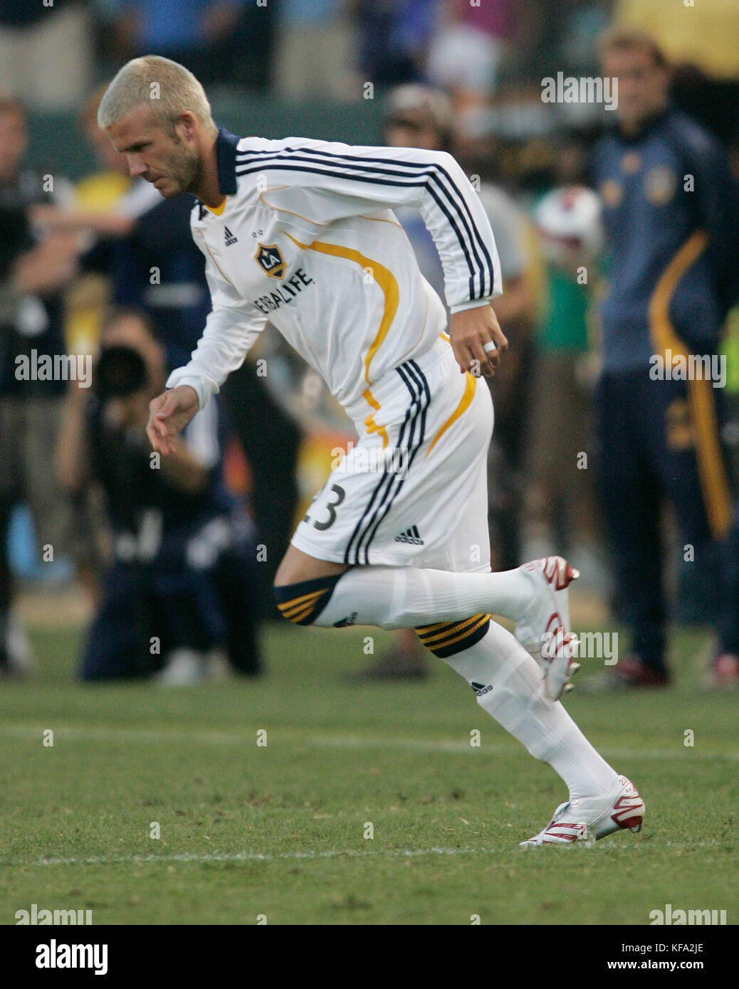 Los Angeles Galaxy's David Beckham runs on to the field against Chelsea ...