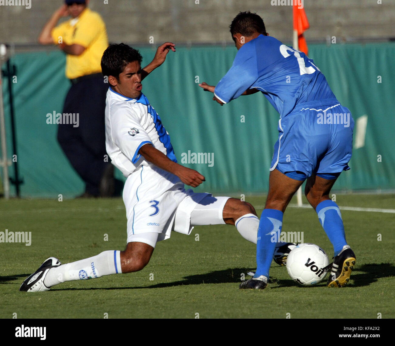 Guatemala's Pablo Melgar, left, tries to pass the ball between the legs ...