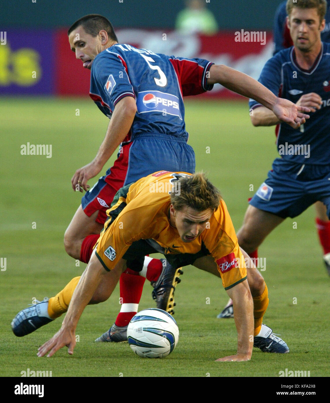 Galaxy's Danny Califf, foreground, protects the ball from Revolution's ...