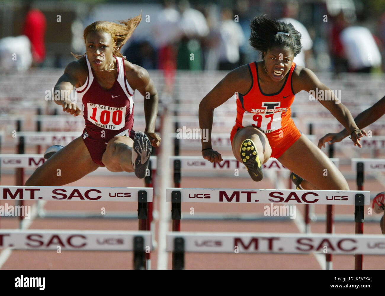 Danielle Carruthers, left, and Perdita Felicien clear hurdles in the ...