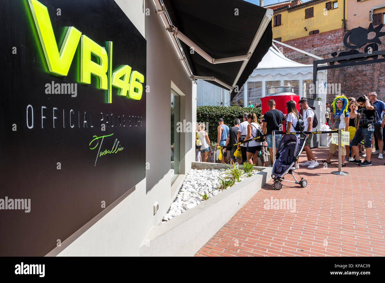 Fans queue at the VR46 merchandise and fan shop. Tavullia, Italy ...