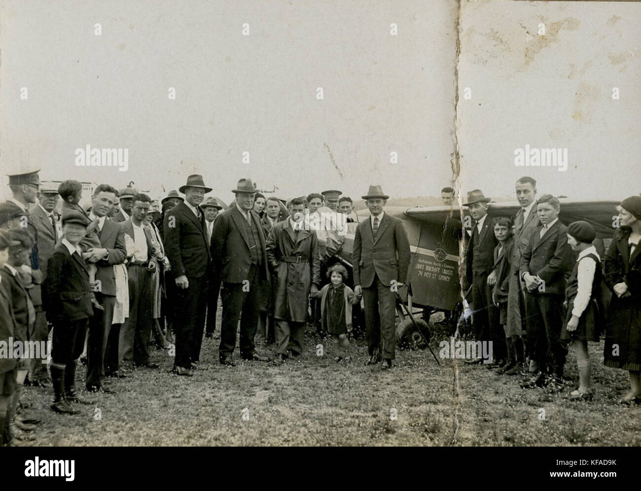 Arthur Butler and his Comper Swift aeroplane G ABRE in field with crowd ...