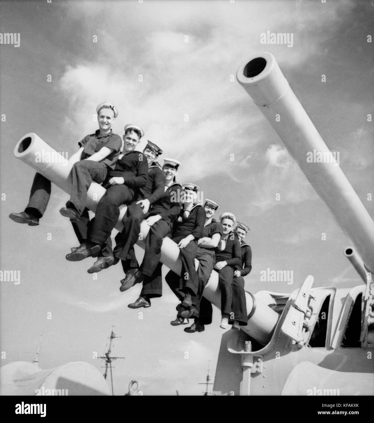 HMAS Perth men astride gun turret, 1941 Stock Photo - Alamy