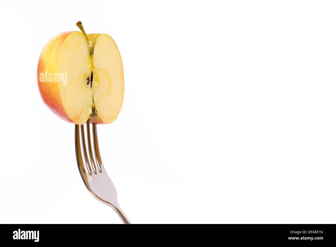 Concept of vegetarian food. Apple on fork Stock Photo - Alamy