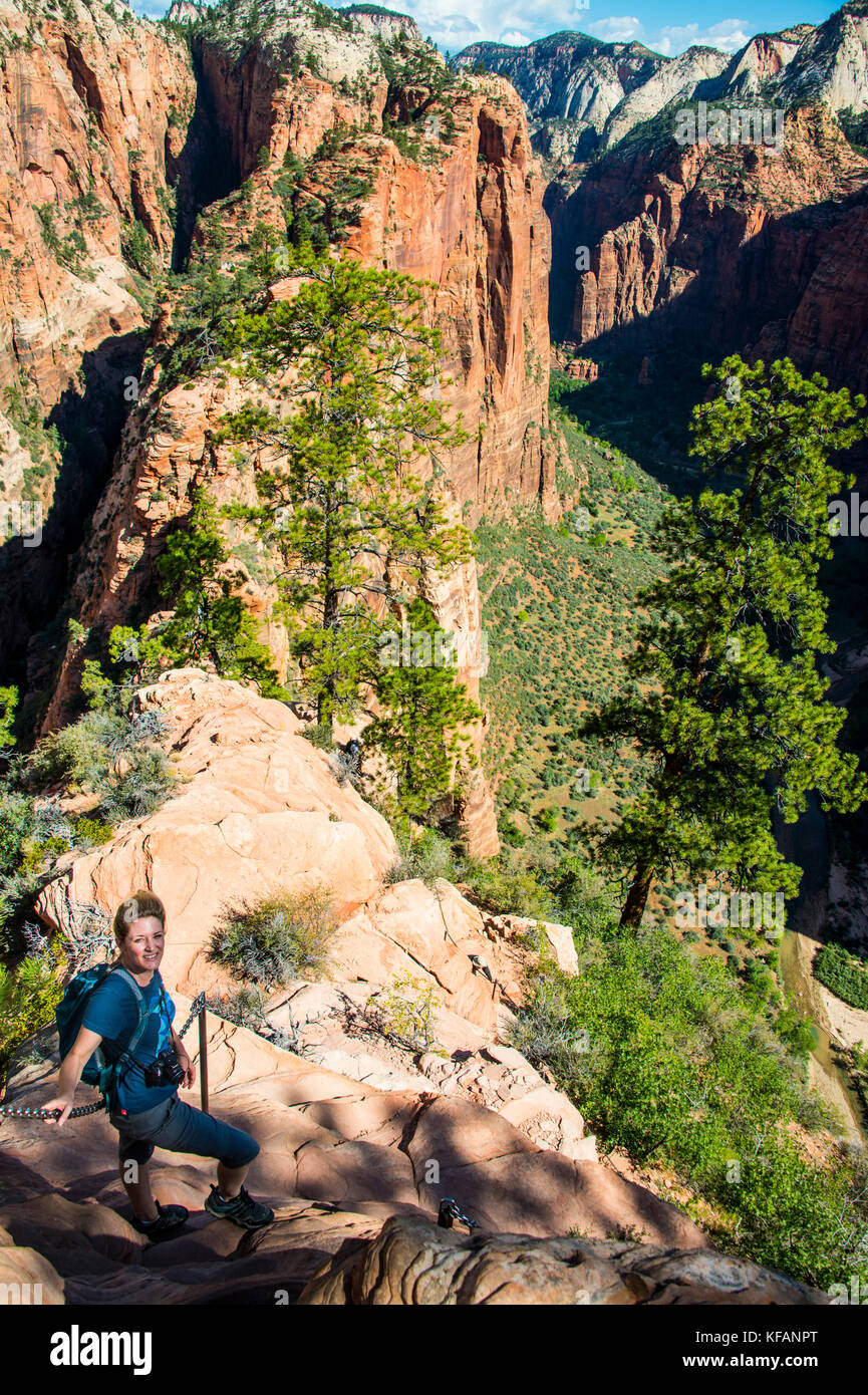 Hiker walking over the narrow edge of Angel´s landing, Zion National ...