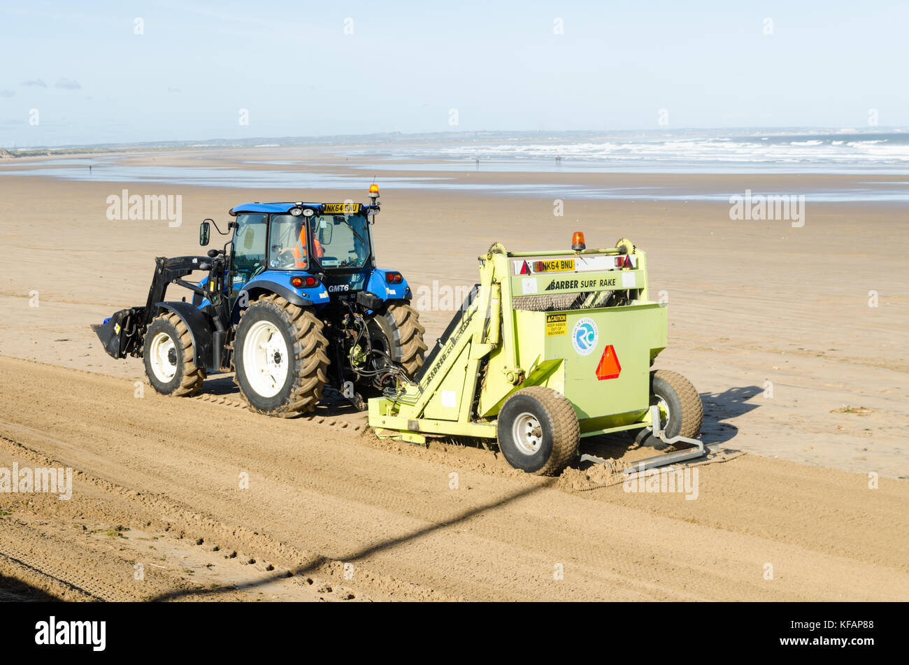 A Tractor Pulling a Beach Cleaner along the Beach Stock Photo - Alamy