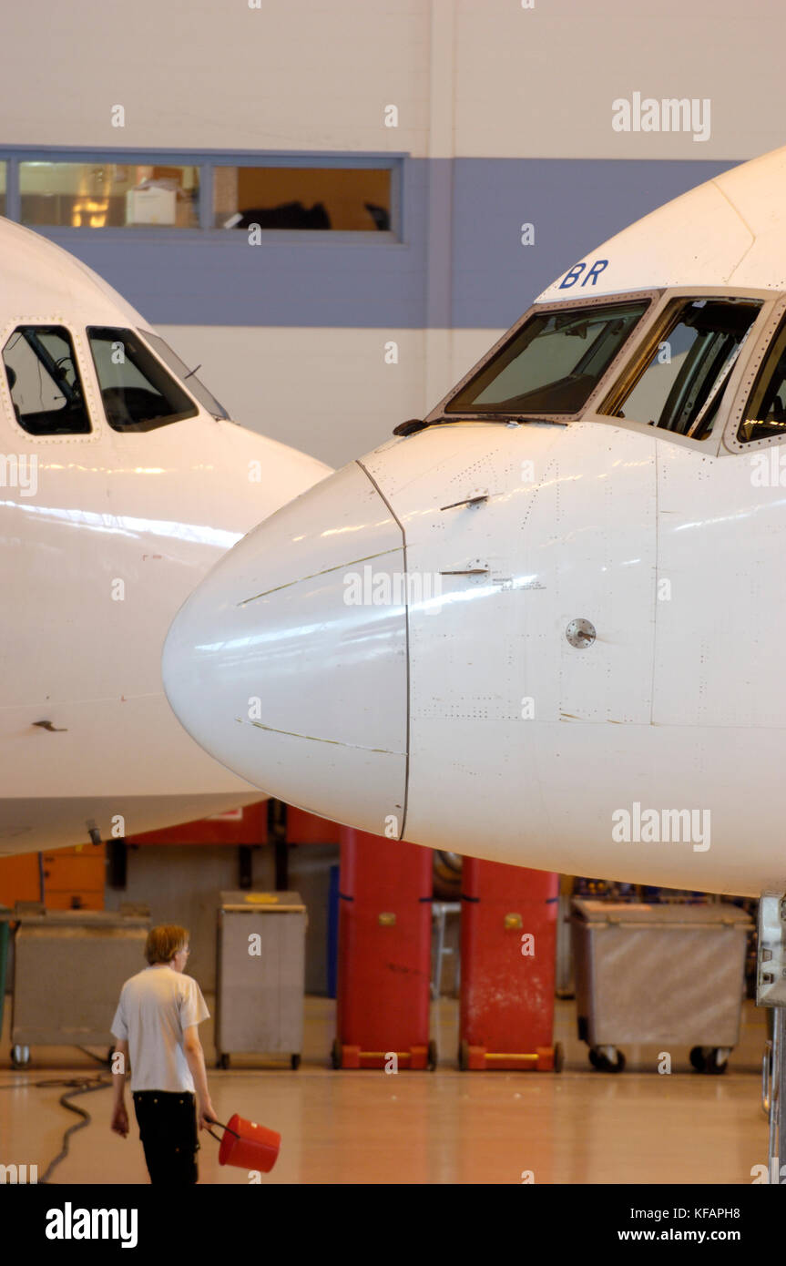 man walking under the windshields of a Boeing 757-200 and Airbus A321 ...