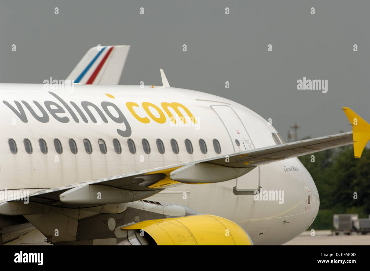wing and fuselage of a Vueling Airlines, Spain Airbus A320-214 taxiing ...