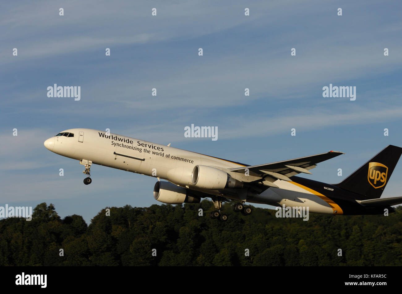 a UPS United Parcel Service Boeing 757-200 climbing out after take-off ...