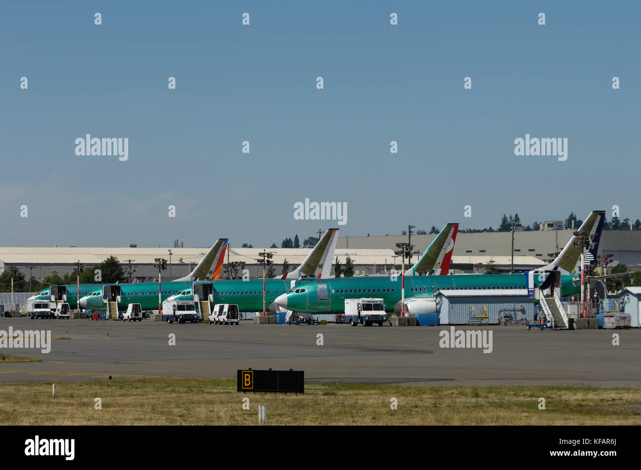 a row of four Boeing 737 Next Generation parked outside the production ...