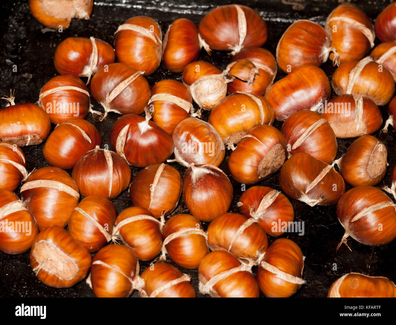 tray of freshly cooked roasted chestnuts autumn forage food kitchen ...