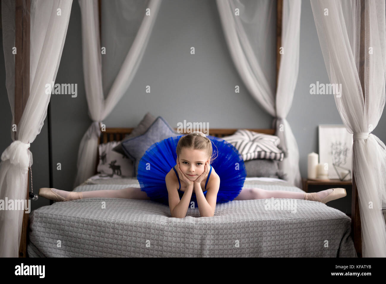 little girl dreams of becoming a ballerina. Child girl in a blue ballet ...