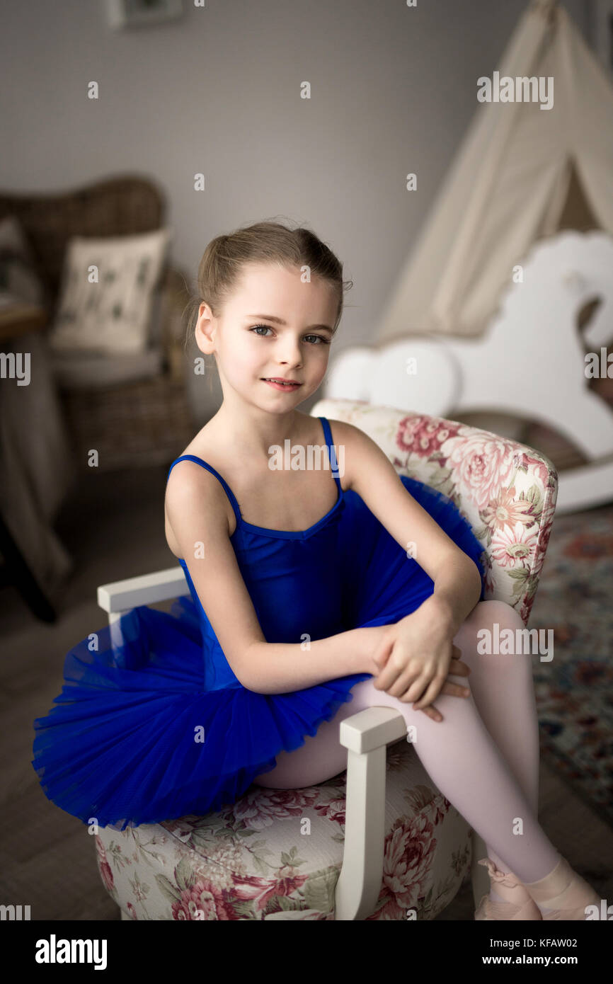 little girl dreams of becoming a ballerina. Child girl in a blue ballet ...