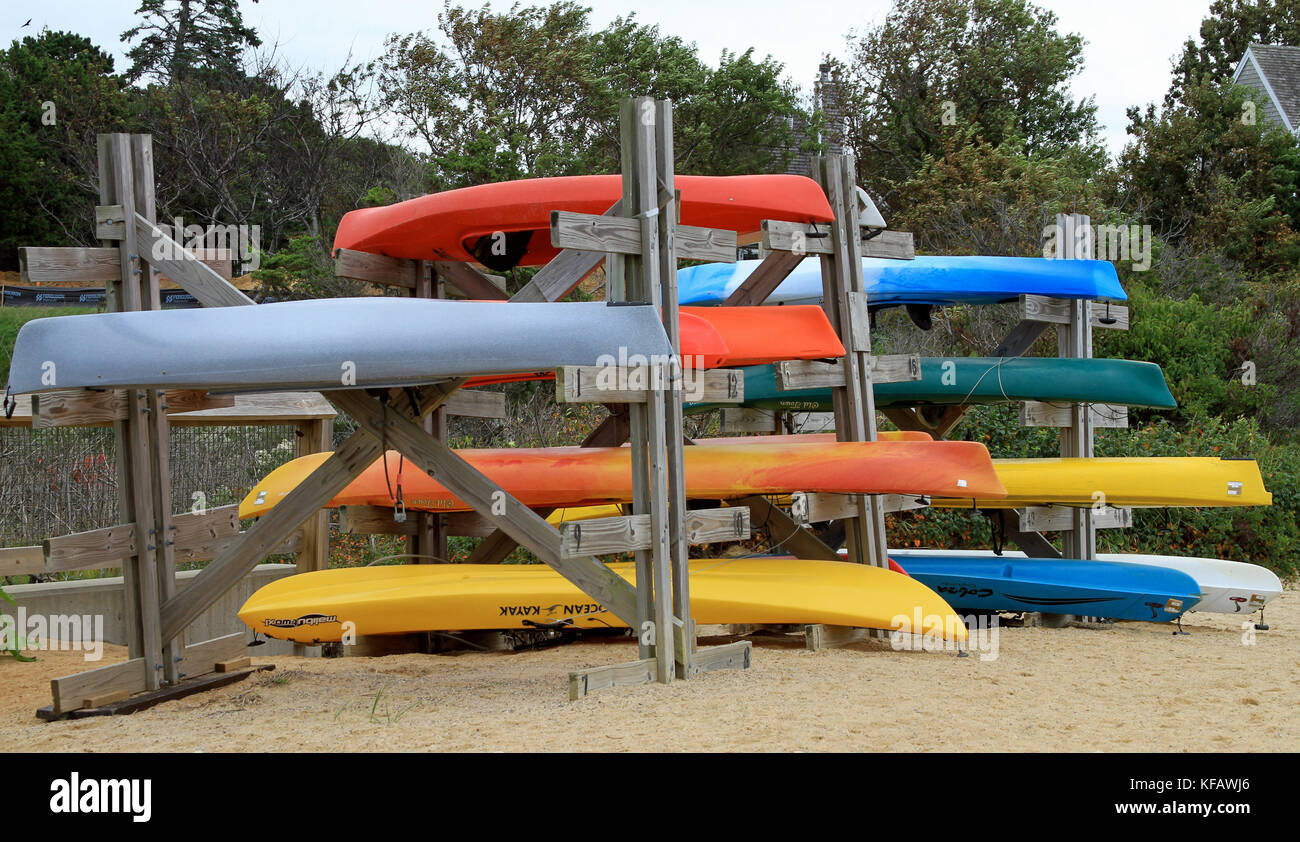 Colorful kayaks stacked on wooden racks at Paine's Creek Beach and ...