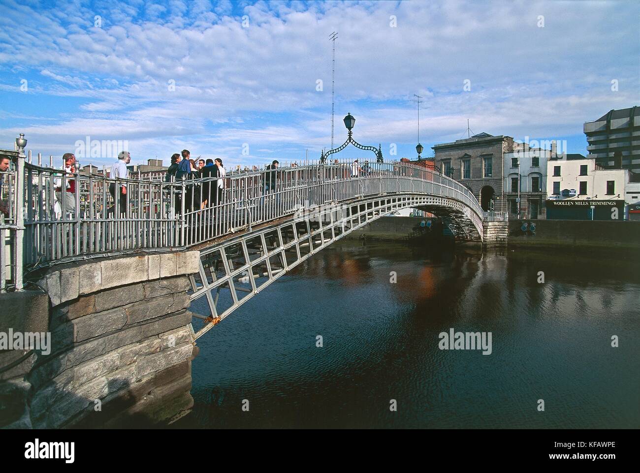 Ireland, Dublin. The Halfpenny Bridge pedestrian bridge over the River ...