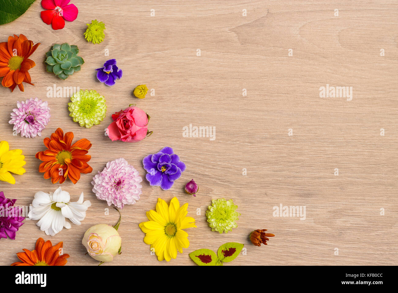 Flowers on wooden table Stock Photo - Alamy