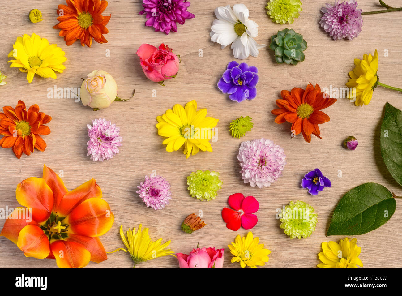 Flowers on wooden table Stock Photo - Alamy