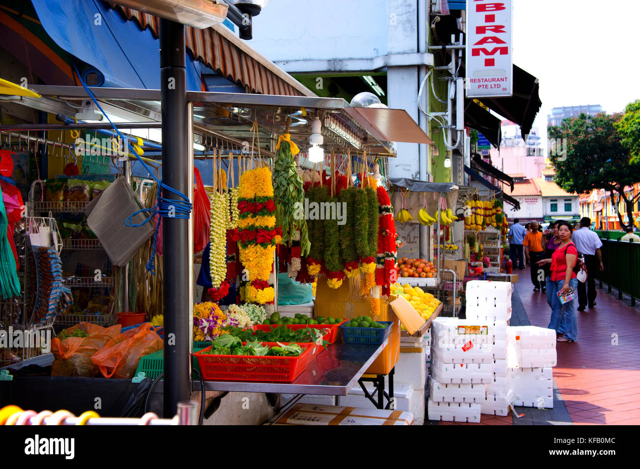Street stalls on the footpath selling fruit and flowers in Little India ...
