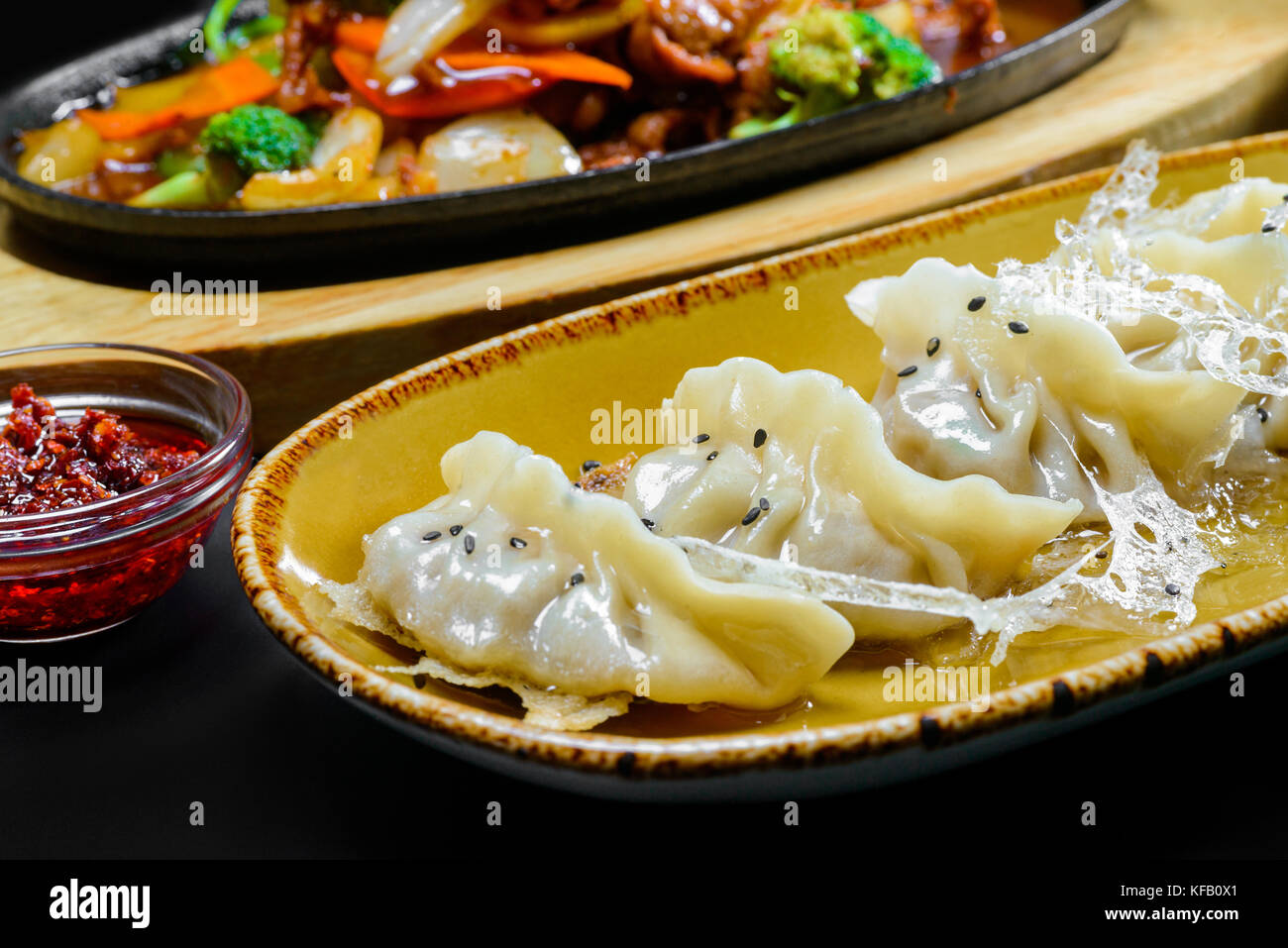 Korean dumplings with sauce Stock Photo - Alamy