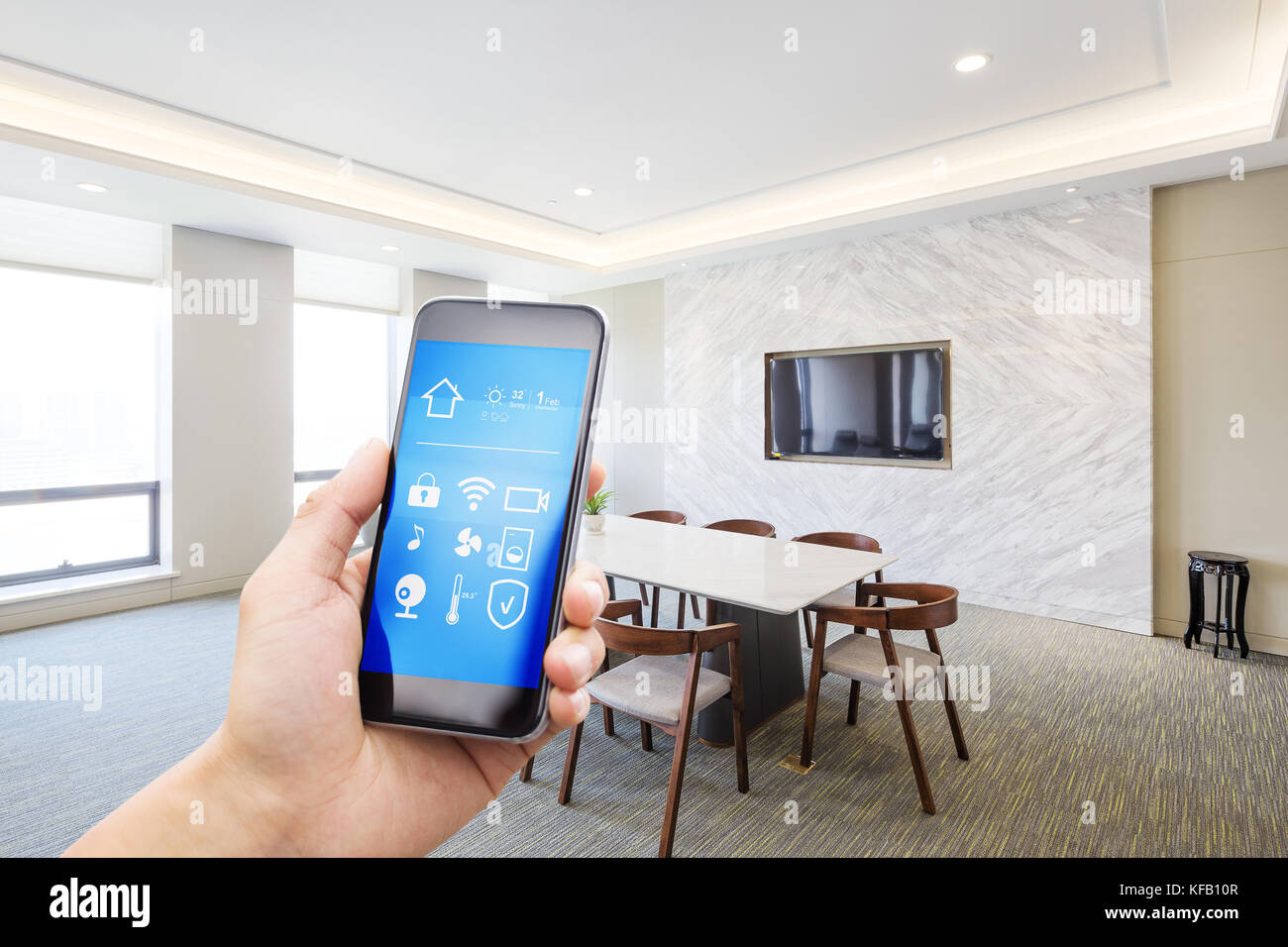 mobile phone with smart home apps in modern meeting room Stock Photo ...