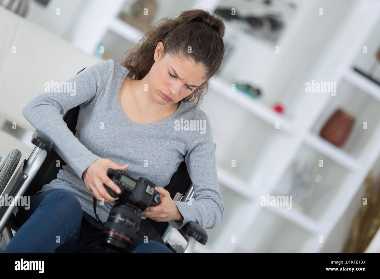disabled female photographer at home Stock Photo - Alamy