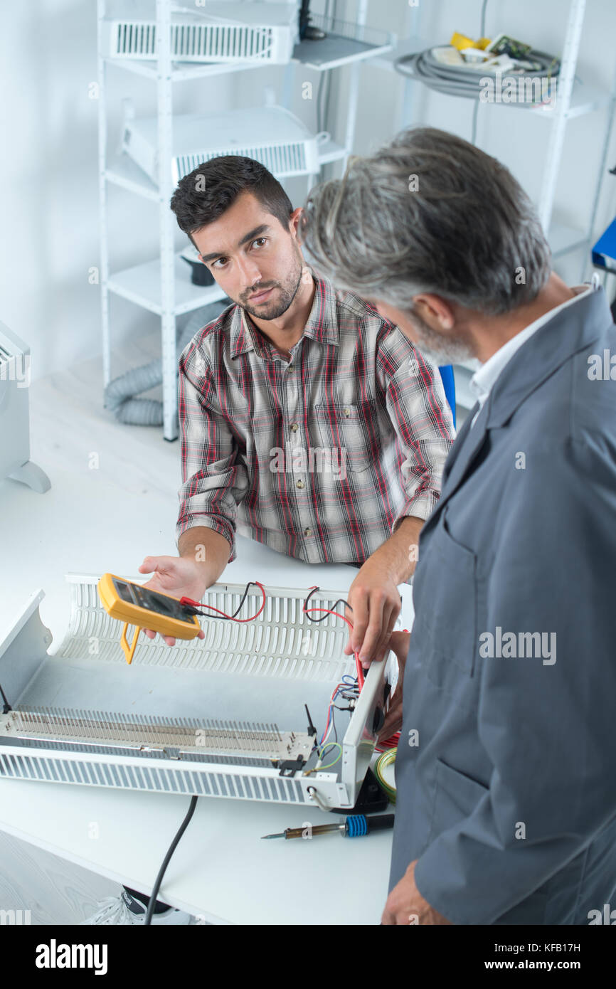 technician calibrating heater Stock Photo - Alamy