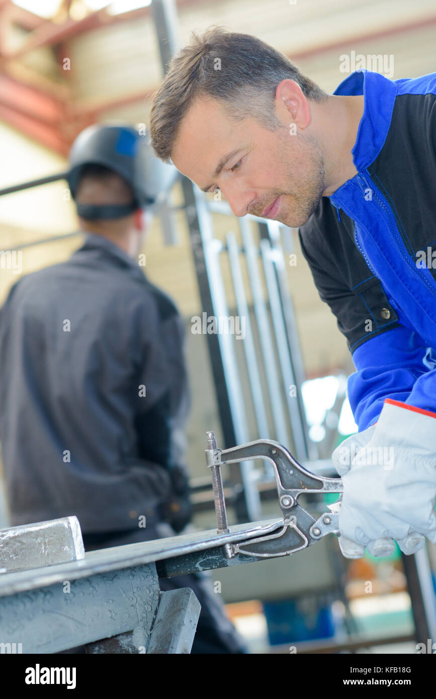 steel worker using clamp Stock Photo - Alamy