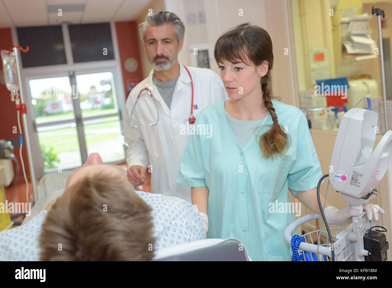 Medical staff dealing with patient Stock Photo - Alamy