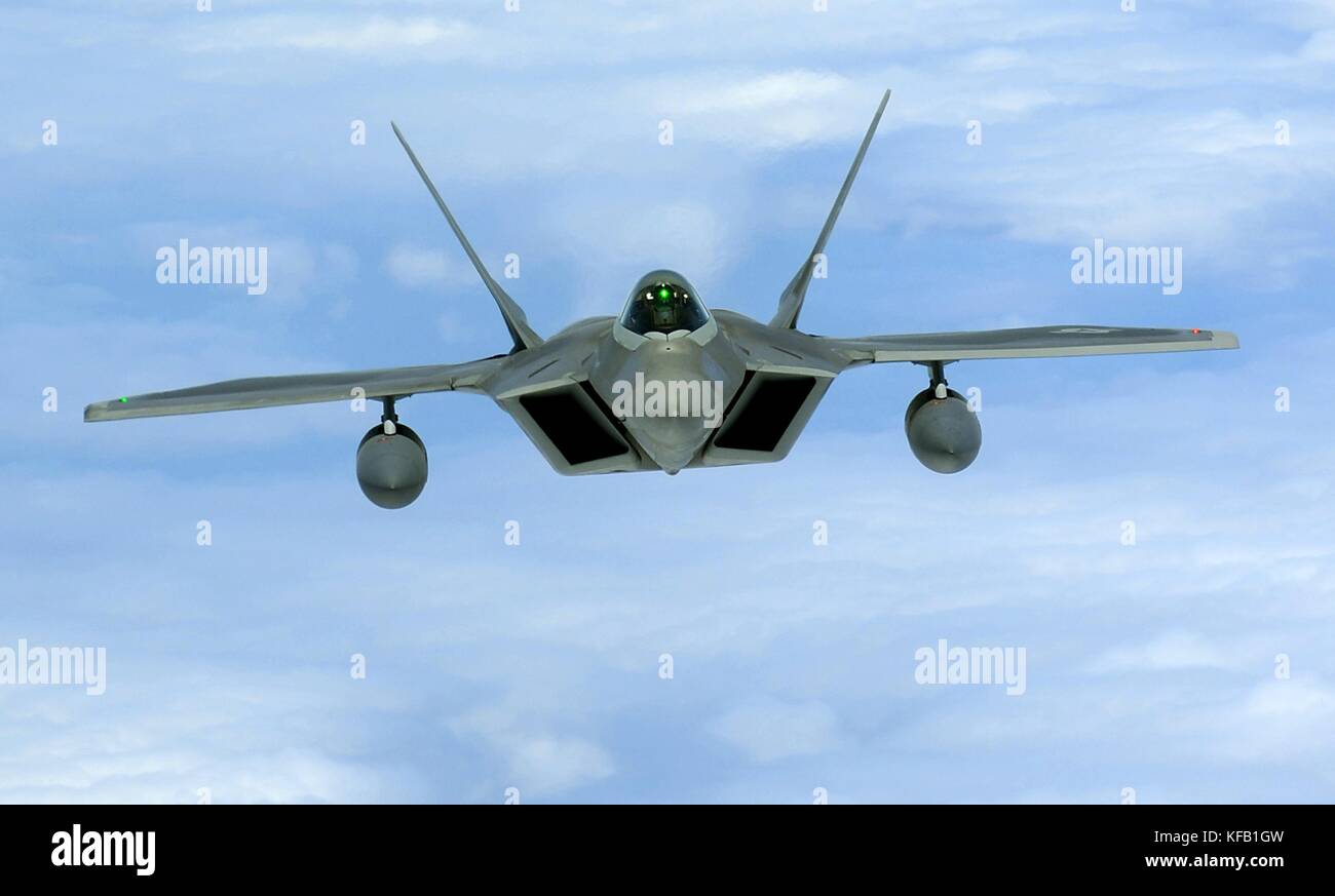 A U.S. Air Force F-22 Raptor stealth tactical fighter aircraft flies ...