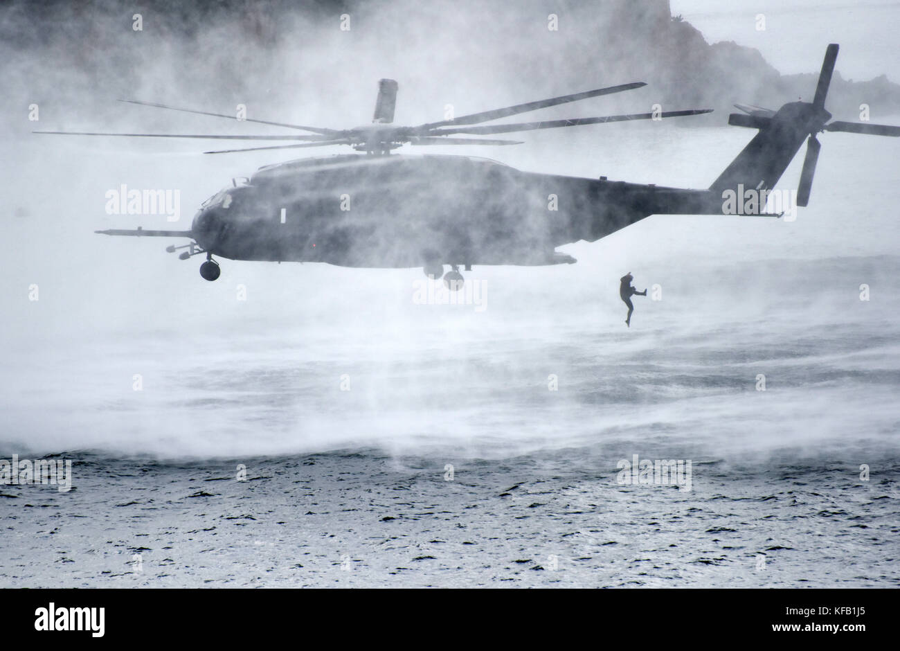 U.S. and South Korean Navy sailors jump out of a U.S. Navy MH-53E Sea ...