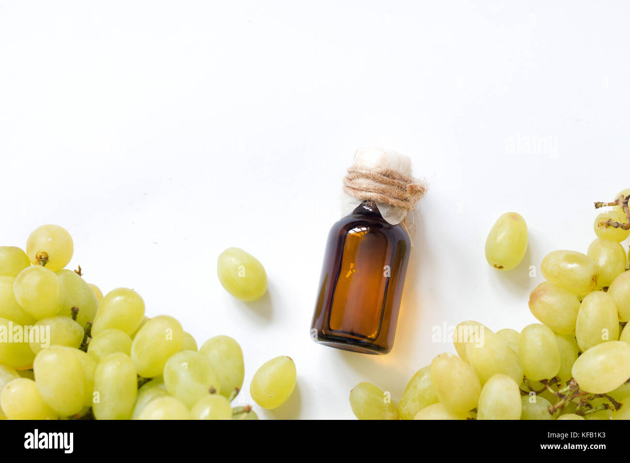 Bottle with grape seed essential oil on a white background Stock Photo ...