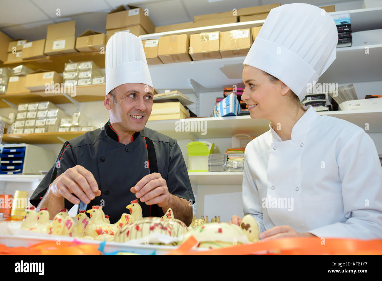 male and female worker at a chocolate shop Stock Photo - Alamy