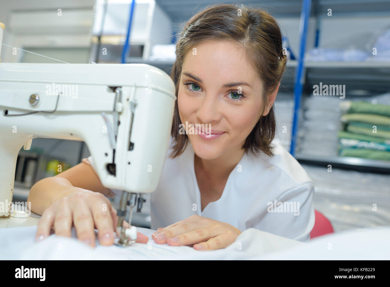 Portrait of woman sewing Stock Photo - Alamy