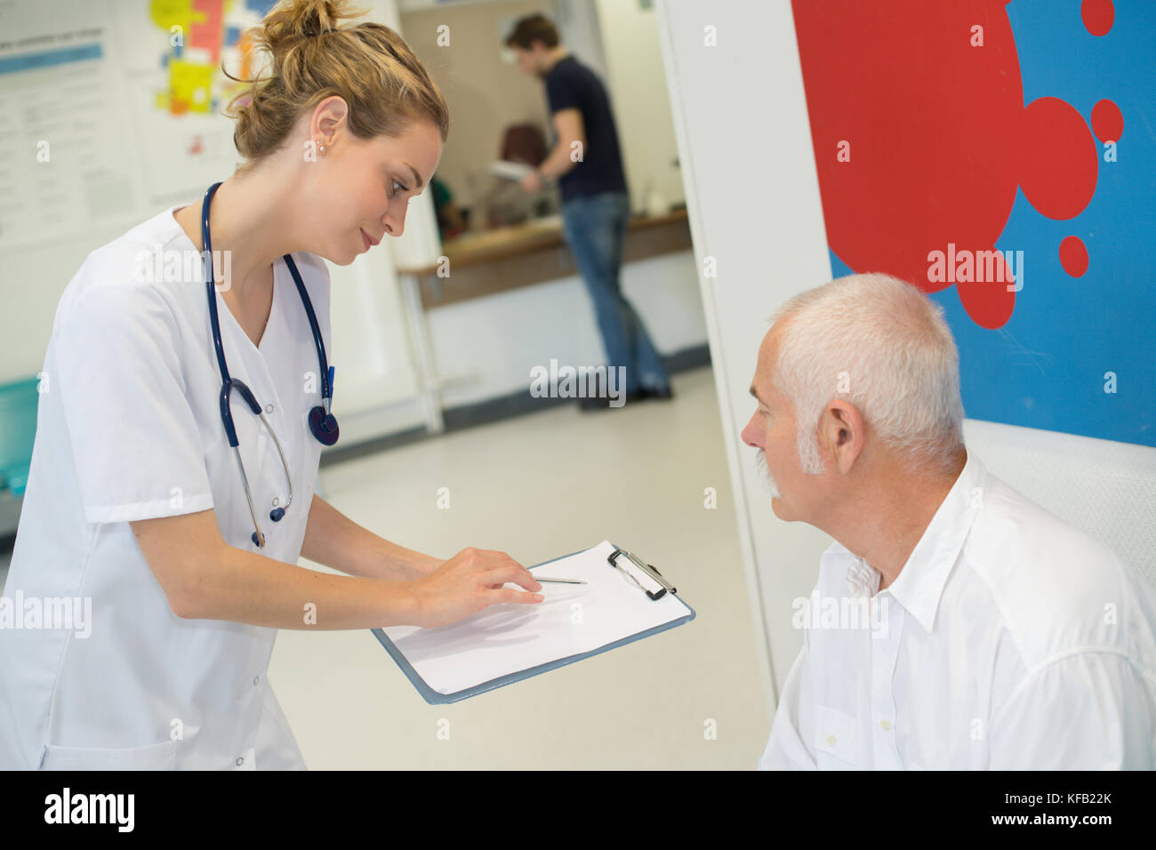 doctor and patient discussing over report in hospital waiting room ...