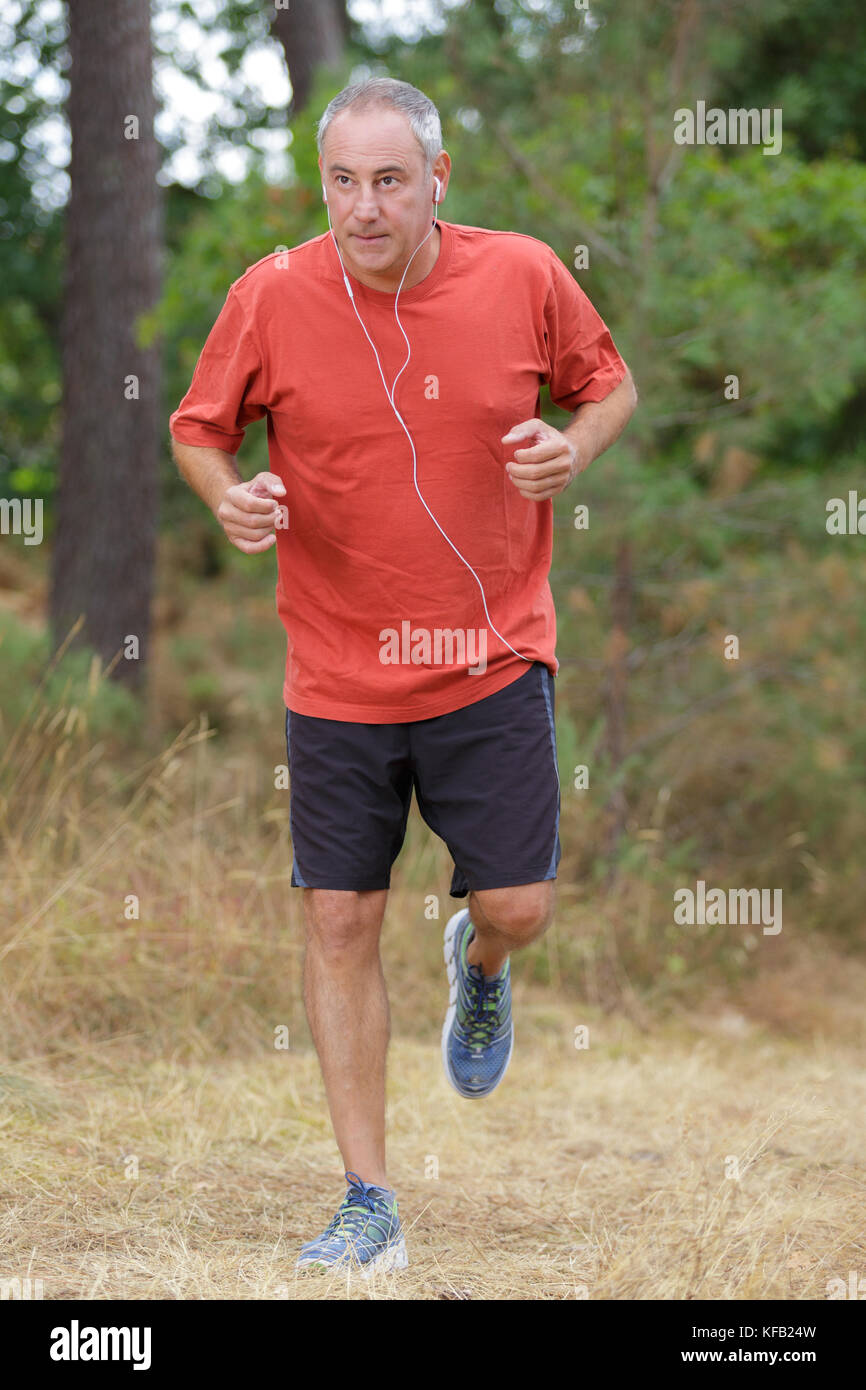 a man running outdoors in the countryside Stock Photo - Alamy