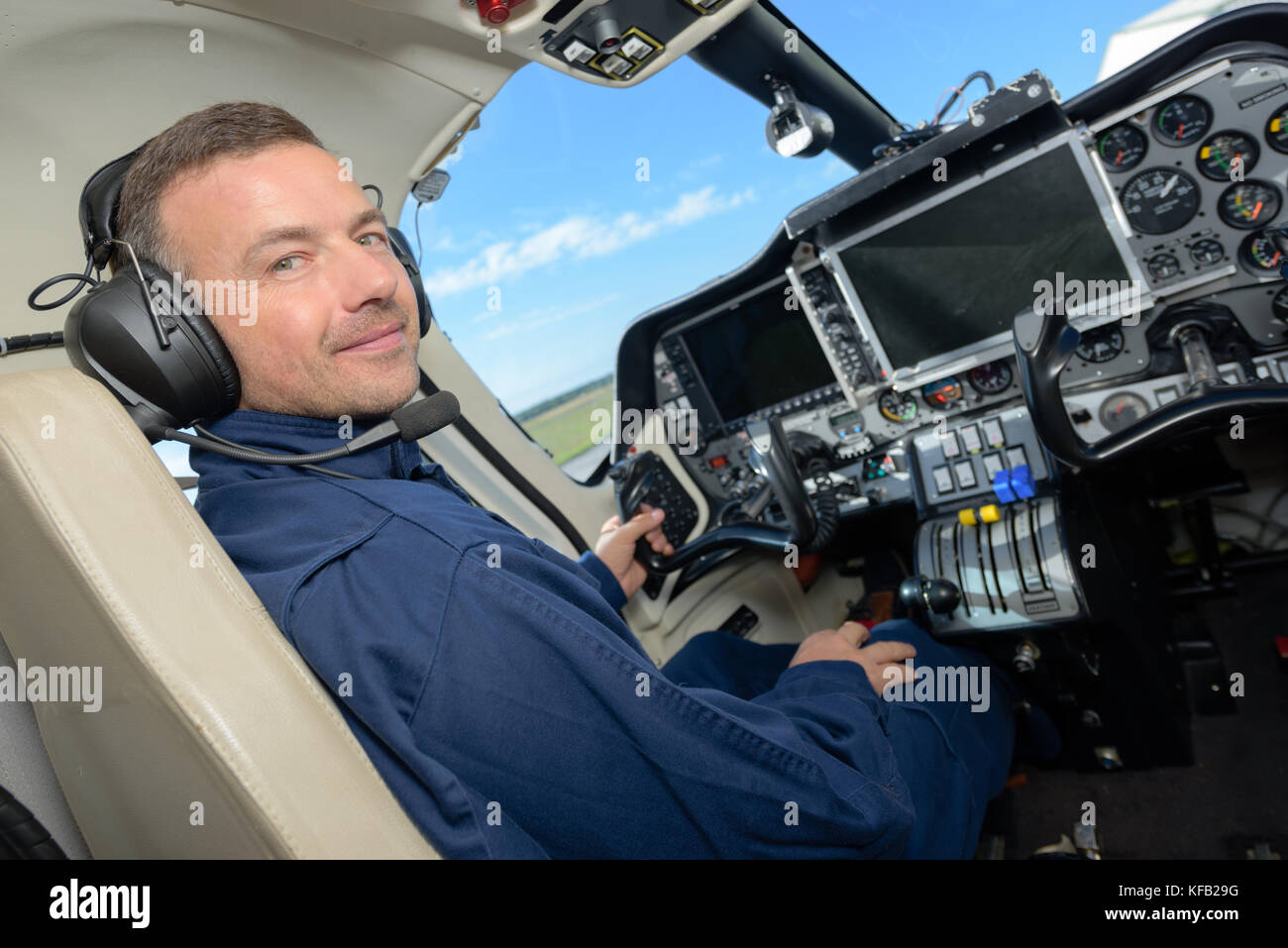 handsome male pilot in the cockpit Stock Photo - Alamy