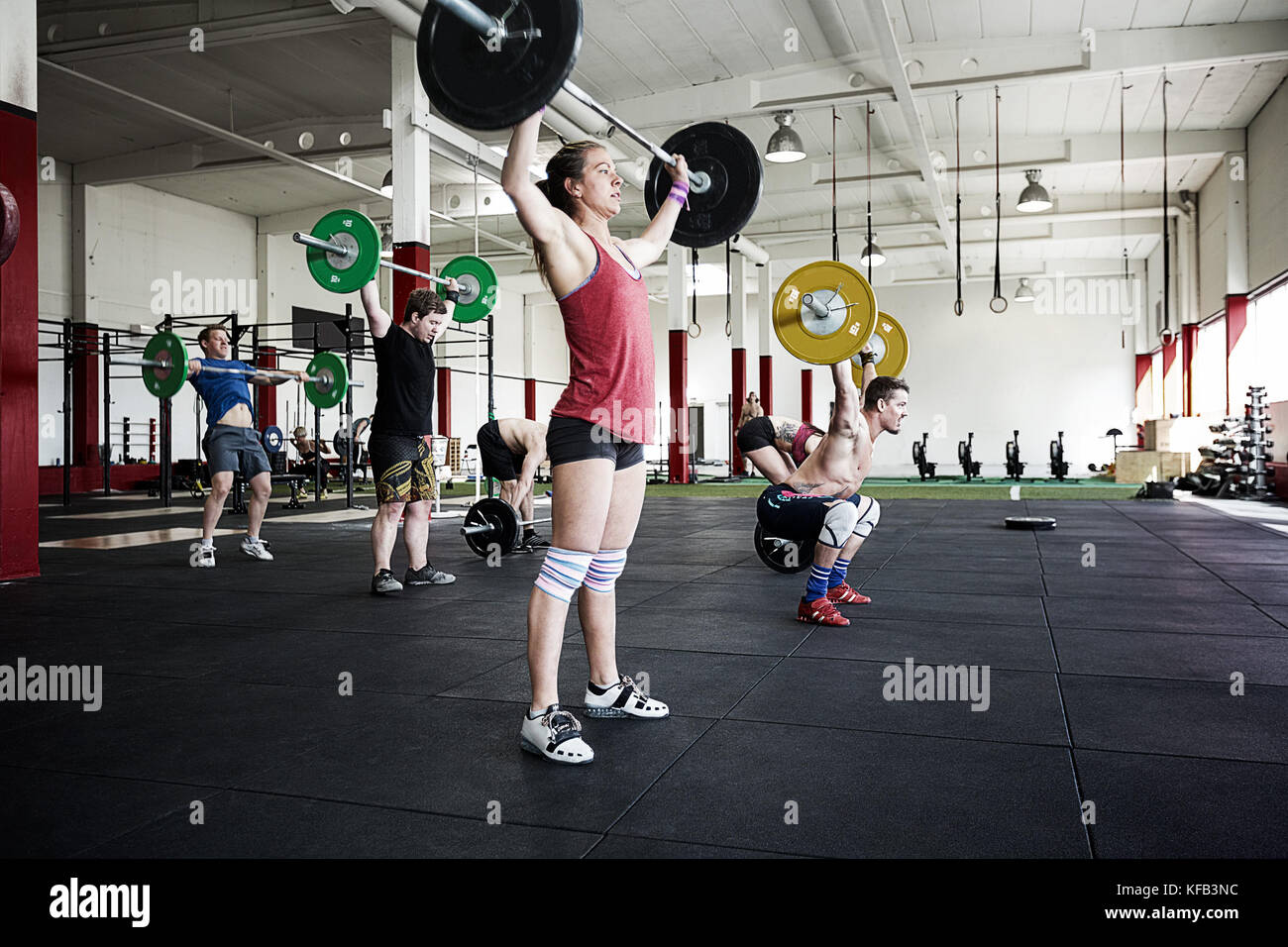 Woman lifting weight bar in hi-res stock photography and images - Alamy