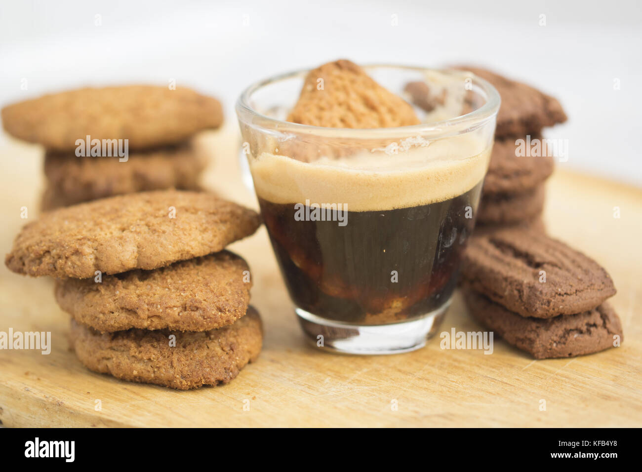 cookie soaked in a cup of espresso coffee Stock Photo - Alamy