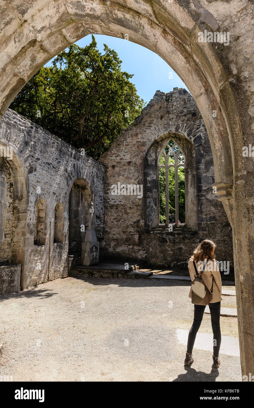 Young girl profile from the back in the Muckross Abbey, Killarney ...