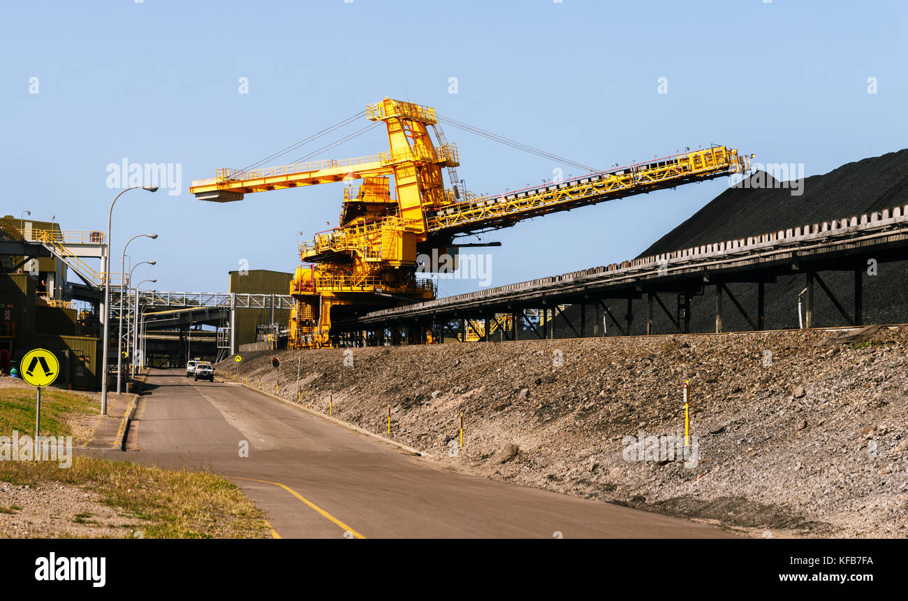 Coal loading and stacking equipment sorting the coal ready for loading ...