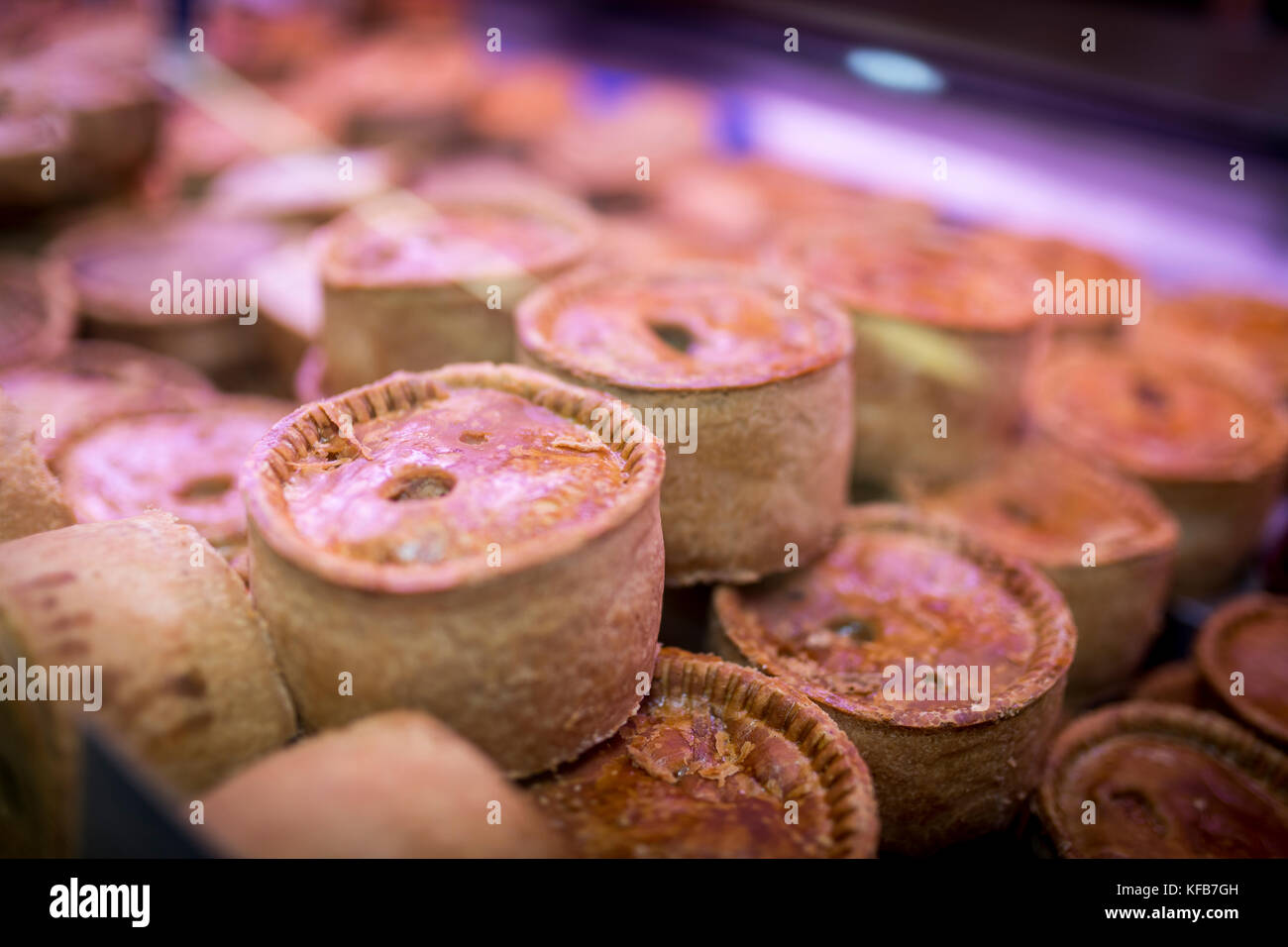 Quality and finest short crust pork pies on display on a market stall ...