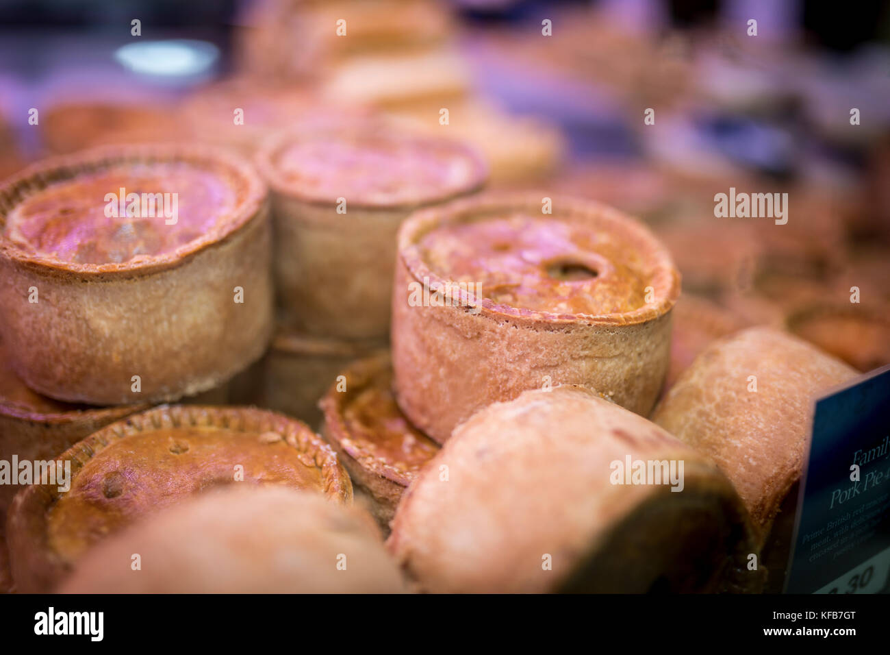 Quality and finest short crust pork pies on display on a market stall ...