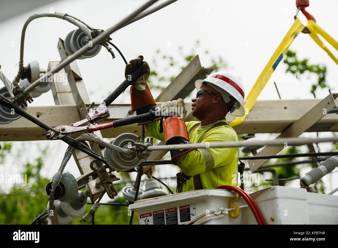 U.S. Army soldiers and Prime Power employees repair power lines during ...