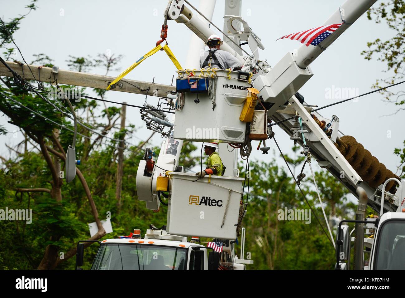U.S. Army soldiers and Prime Power employees repair power lines during ...