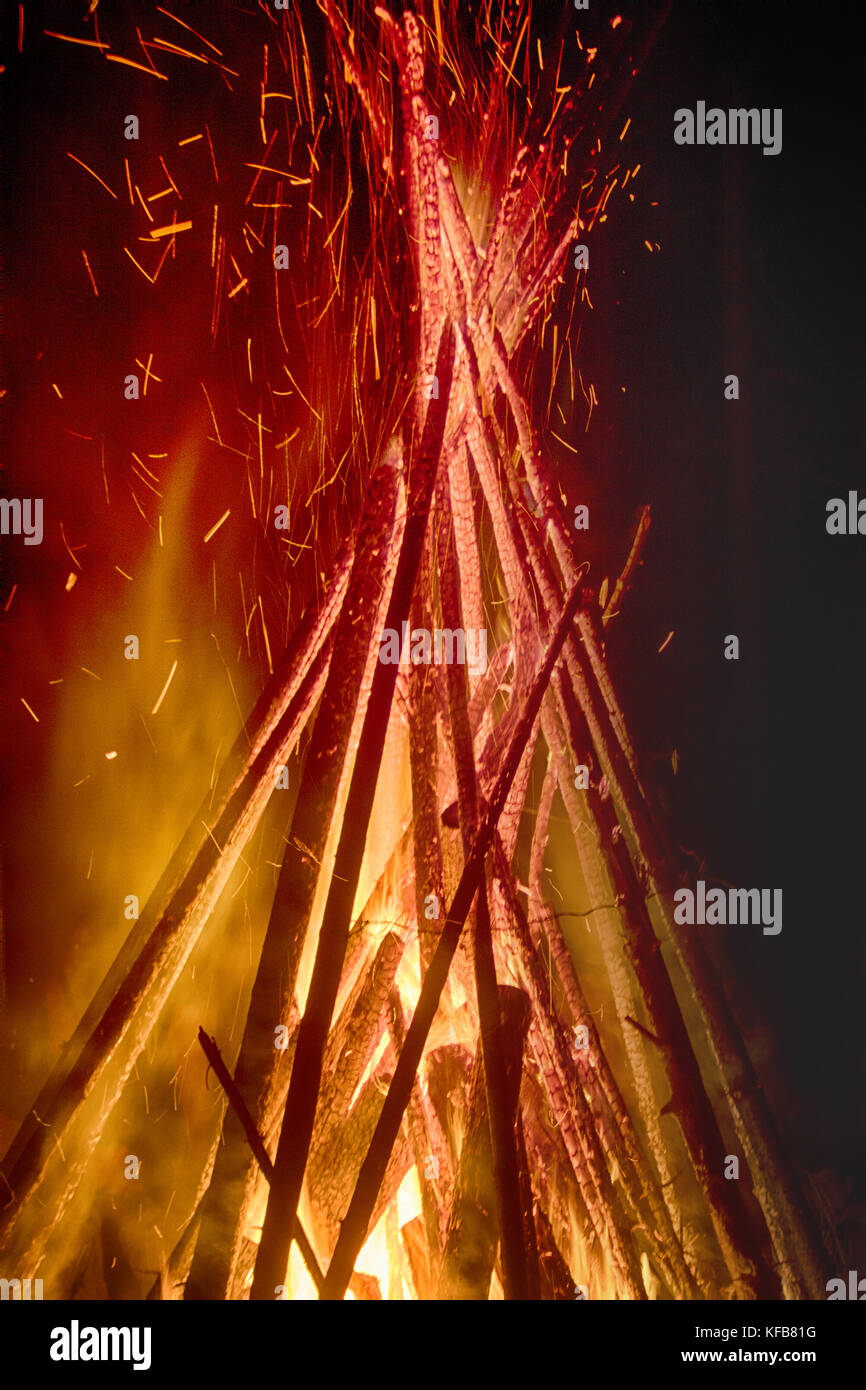 Element of fire, huge night fire on holiday. Dance sparks, Pyromania ...