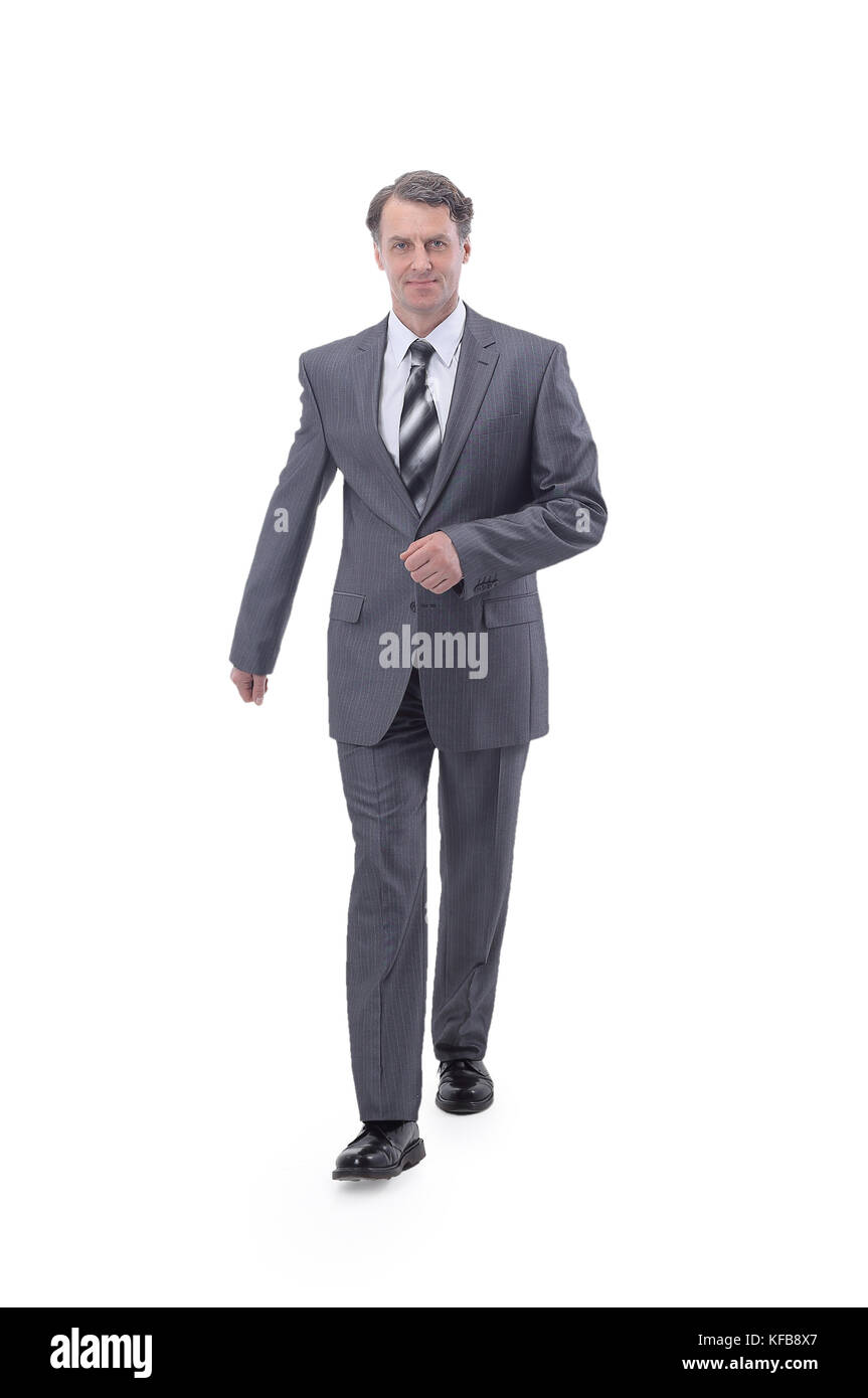 in all growth.a successful businessman, confidently striding forward ...