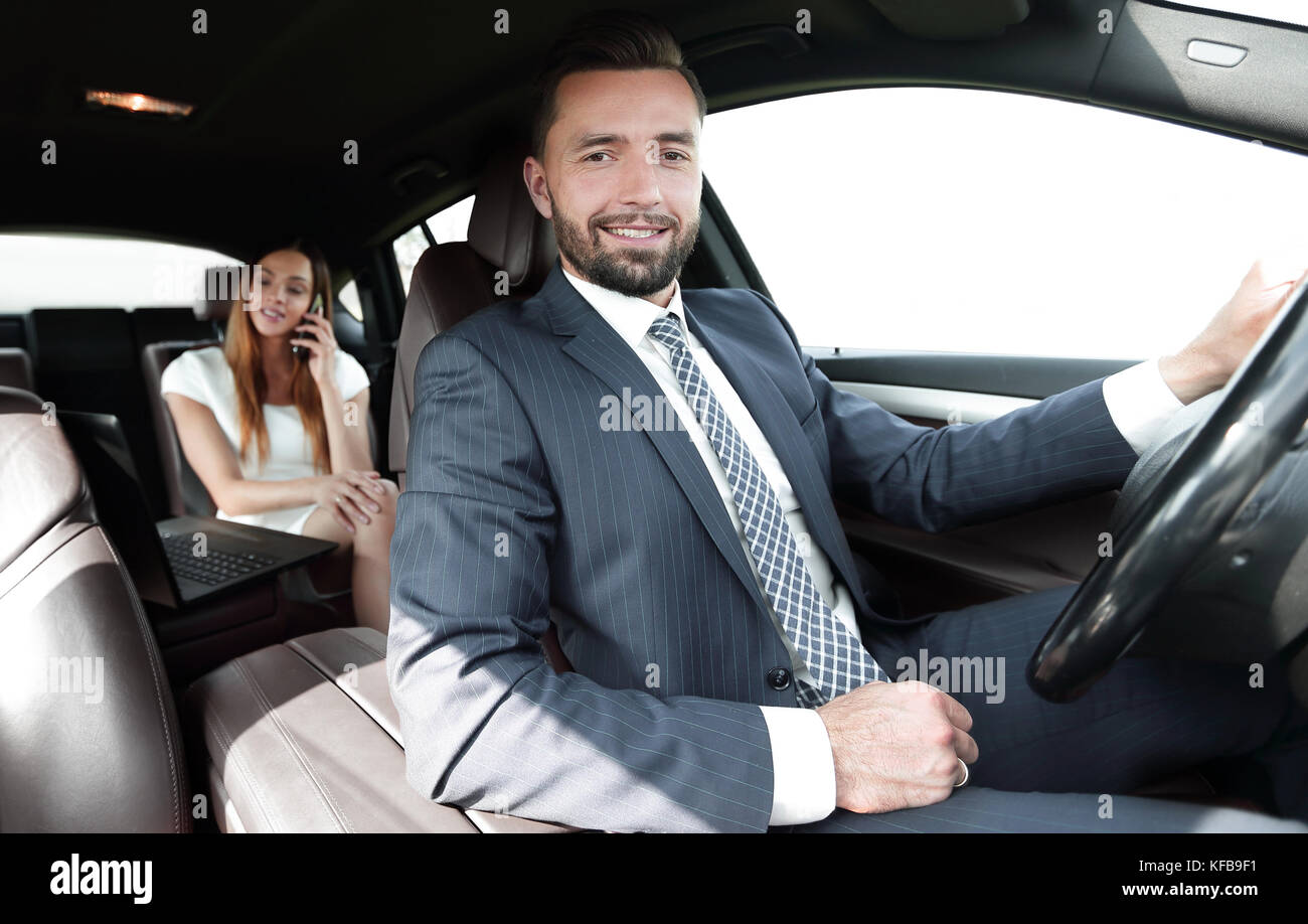 Attractive elegant serious man drives good car Stock Photo - Alamy
